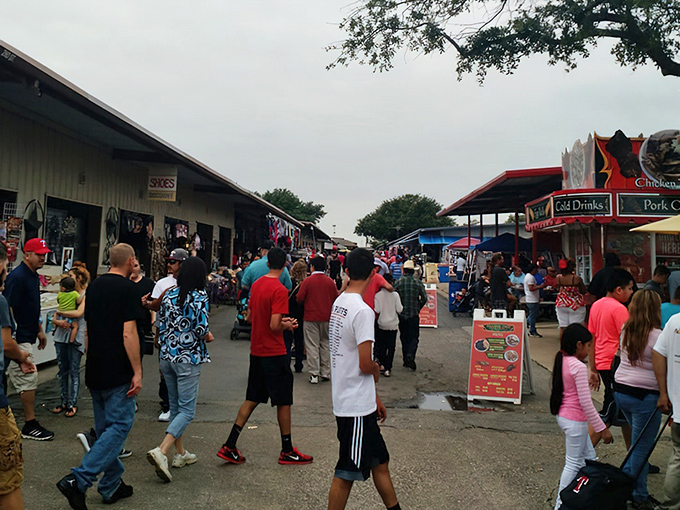 The weekend crowd flows through Traders Village like bargain-hunting pilgrims on their way to the promised land of deals.
