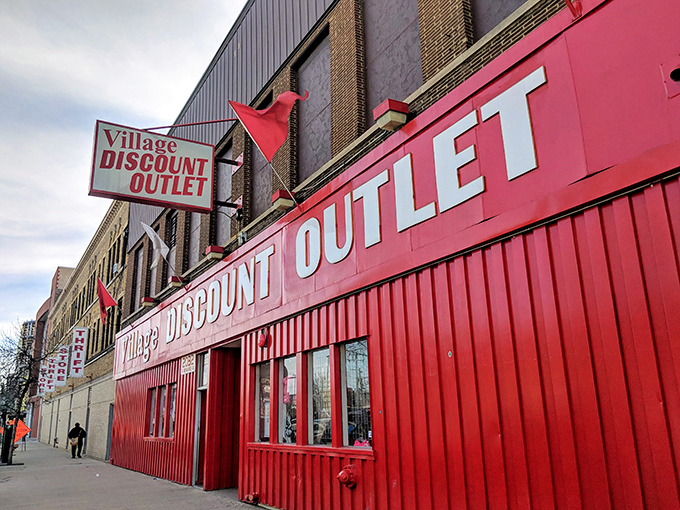 Village Discount's iconic red storefront stands out like a cardinal in winter. Step inside to discover why thrifters consider this their happy place.