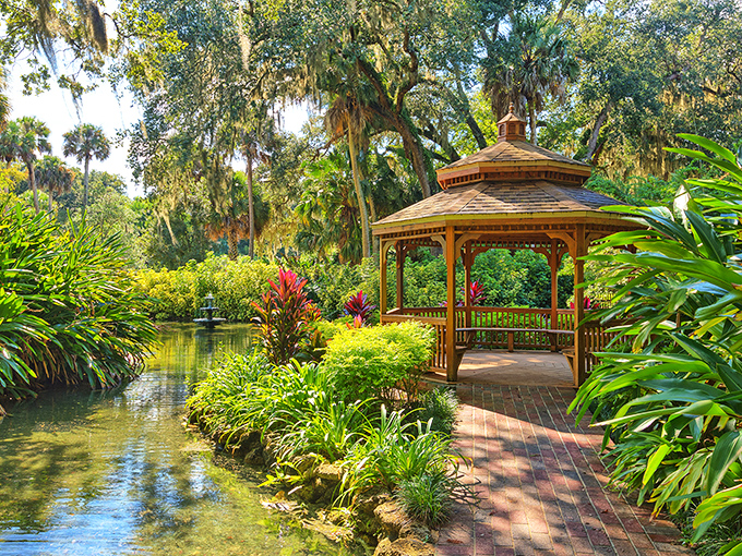 This gazebo knows how to make an entrance &ndash; surrounded by tropical blooms like a movie star at a premiere.