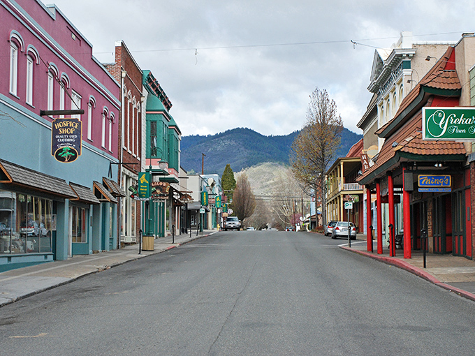 Those colorful storefronts against mountain backdrops create a postcard scene that makes you want to slow down and savor.