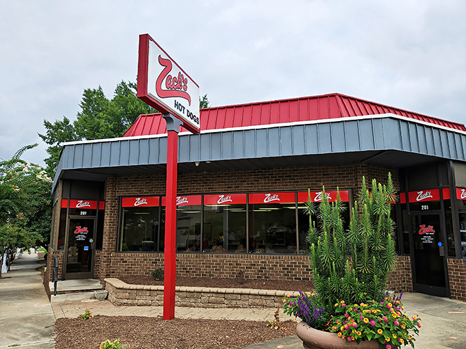 The red awnings of Zack's Hot Dogs frame this temple of tube steak perfection, where time seems to stand still and calories don't count.