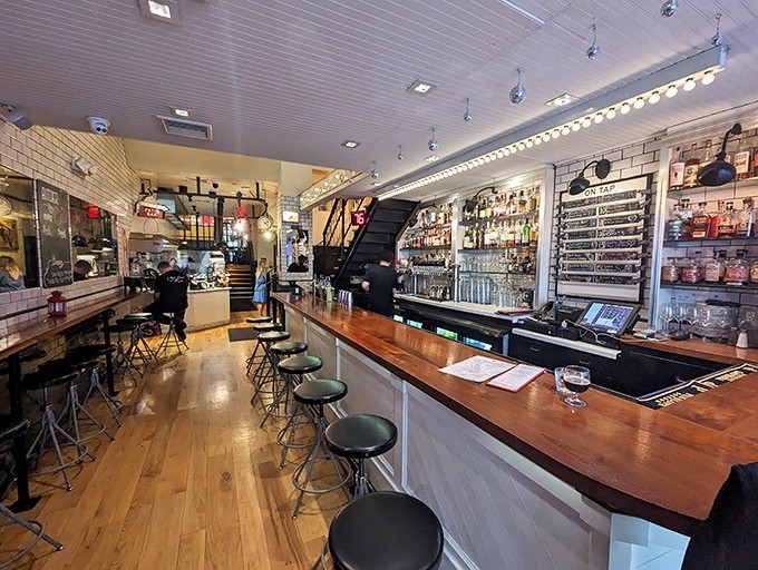 Warm wood meets industrial chic at the bar, where craft cocktails and conversation flow as freely as the local beer on tap.