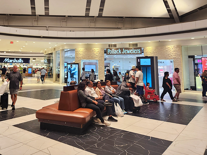 The universal language of shopping: waiting patiently while your companions hunt for treasures. These benches have witnessed countless "just five more minutes" promises.