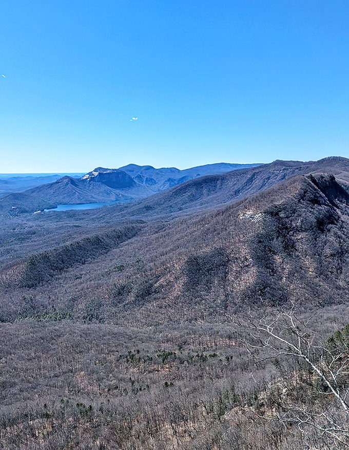 Winter reveals the sculptural bones of the landscape, with bare mountains creating a stark, beautiful panorama. The crisp air makes the view even more breathtaking—literally!