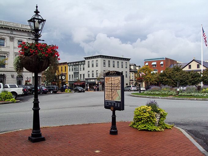 The town square where every lamppost seems personally polished and every flower bed meticulously maintained for maximum charm.