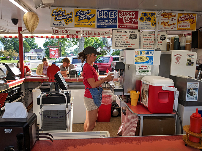 Behind this counter, culinary magic happens with choreographed precision. The staff moves with the efficiency of dancers who've perfected their steps through decades of practice.