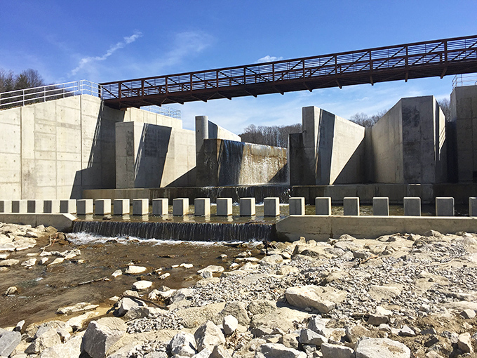 Engineering meets wilderness at the park's impressive dam structure, where concrete angles contrast beautifully with the surrounding natural landscape.
