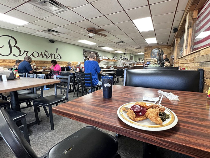 Inside, wood-paneled walls and simple furnishings set the stage for the real stars—those heaping plates of Southern comfort that make diets weep with jealousy.