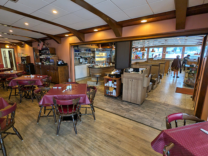Inside, burgundy vinyl booths and wooden beams create that perfect diner atmosphere where coffee flows freely and breakfast dreams come true.