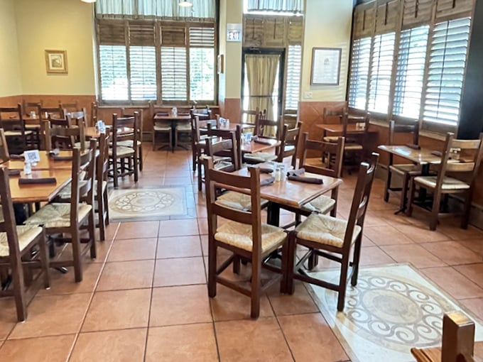 Simple wooden chairs and terracotta tiles create an atmosphere that whispers "authenticity" rather than shouting "theme restaurant." This is Italy without the airfare.