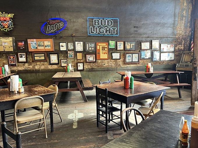 Decades of smoke have painted these walls with the most delicious patina in Texas. Each frame on the wall? A chapter in barbecue history.