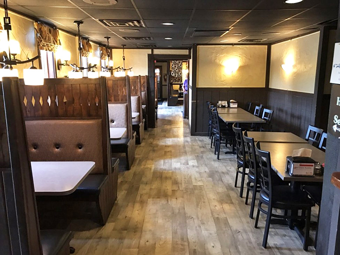 Classic wooden booths create intimate dining nooks where countless Wisconsin memories have been made, one slice at a time.