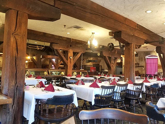 Massive wooden beams frame your dining experience like a historical hug, while white tablecloths whisper, "Yes, this meal matters."