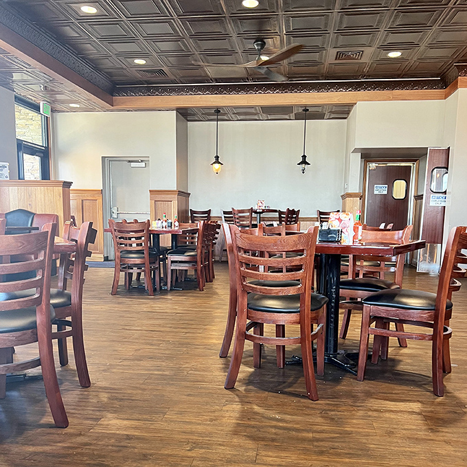 Warm wood tones and classic ladder-back chairs invite you to settle in. This isn't fast food territory&mdash;it's a place where conversations happen.
