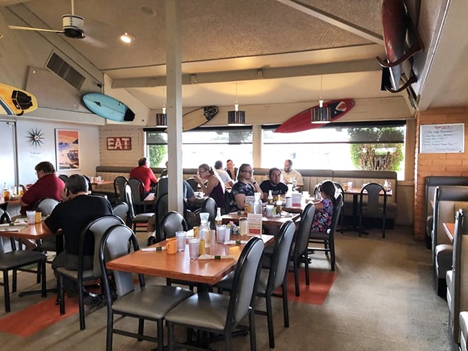 Inside, surfboards hang from the ceiling like trophies of breakfast victories past, while diners commune over steaming mugs of coffee.