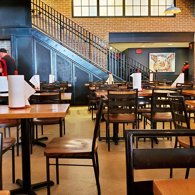 Industrial-chic meets Southern comfort in this airy dining space. The pig artwork watching over diners is a delicious harbinger of things to come.