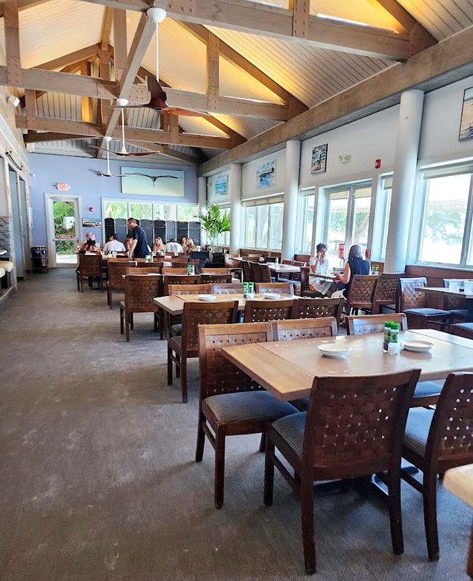 Exposed wooden beams and natural light create the perfect backdrop for seafood indulgence. Like dining in a stylish beach house where someone else does the dishes.