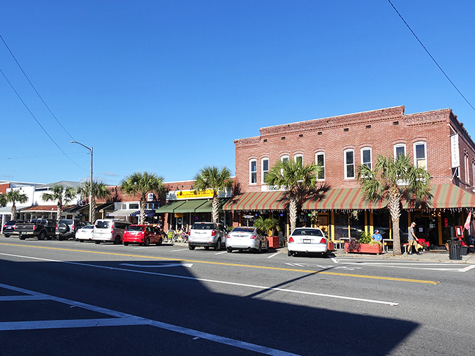 These brick storefronts have witnessed over a century of coastal stories. The awnings aren't just charming&mdash;they're necessary survival gear in the Florida sun.