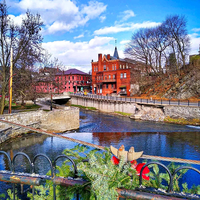 Spring Creek flows through downtown like nature's own Main Street parade, complete with historic brick buildings as spectators.