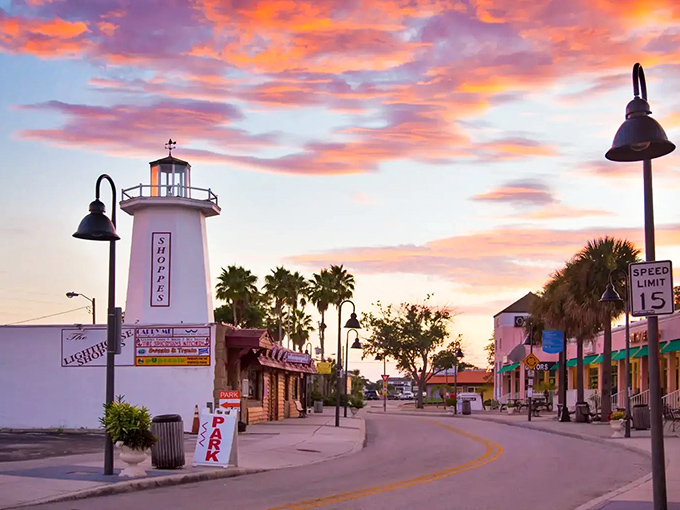 Sunset paints the sky in watercolor hues behind Tarpon Springs' iconic lighthouse, where palm trees and Mediterranean architecture create Florida's most convincing Greek impersonation.