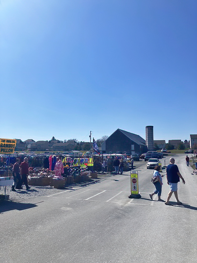 Where treasure hunting begins! Under clear skies and fluffy clouds, shoppers navigate the outdoor vendor maze at Green Dragon.