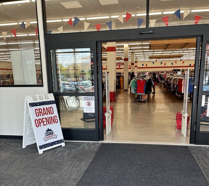 Red and blue pennants flutter overhead like a permanent celebration, welcoming shoppers to the grand opening of possibility.