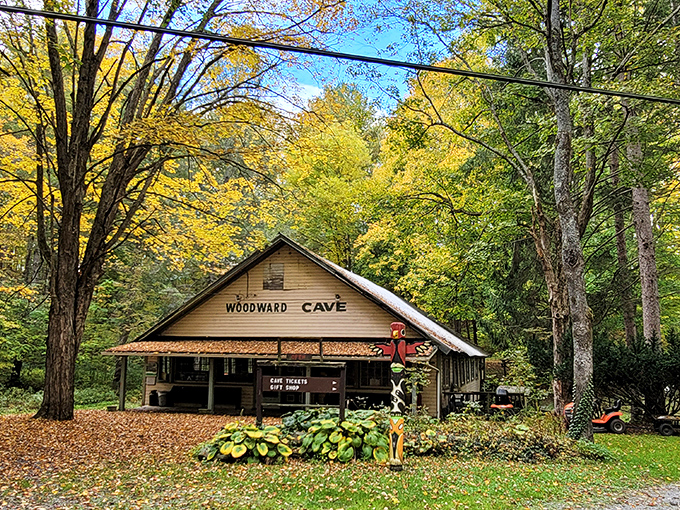 Fall foliage frames the rustic ticket building like Mother Nature's welcome mat &ndash; a humble prelude to the underground spectacle waiting below.