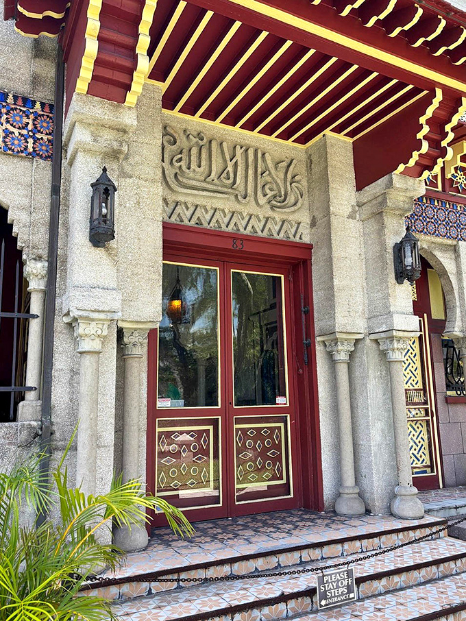The entrance speaks volumes before you even step inside&mdash;Arabic inscriptions, ornate red doors, and geometric patterns promising an architectural adventure unlike anything else in Florida.