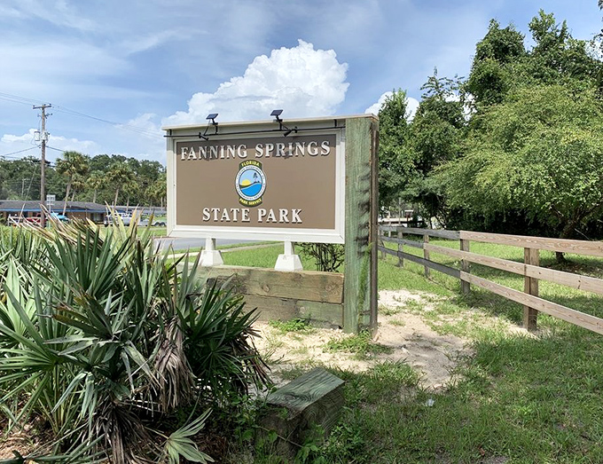 Welcome to the club! This unassuming sign marks the threshold between ordinary life and the extraordinary natural wonder waiting just beyond.