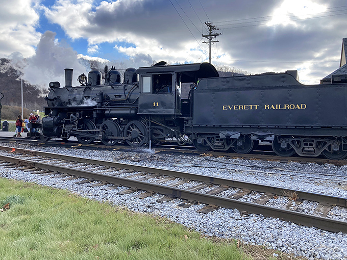 Engine No. 11 stands proudly at the station, its gleaming black exterior and gold lettering promising adventures straight out of a storybook.