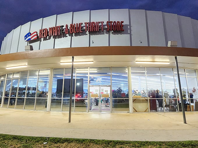 As night falls, the illuminated storefront beckons bargain hunters like a lighthouse guiding ships toward a sea of second-hand wonders.
