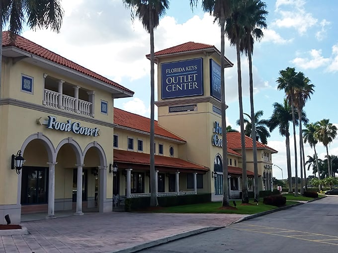 The Food Court entrance beckons like a Spanish villa promising sustenance for weary shoppers and refuge for patient partners.