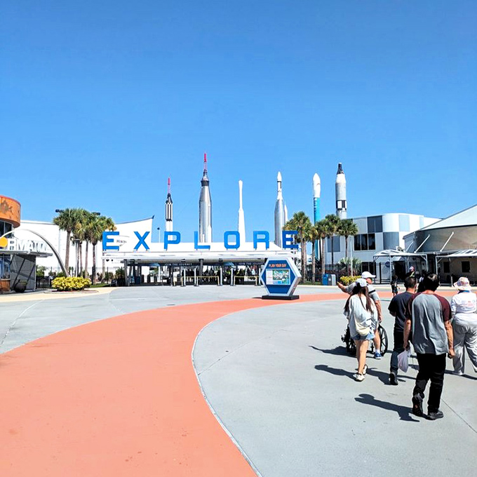 The EXPLORE entrance beckons visitors with the promise of adventure, flanked by rockets that once danced with the stars.