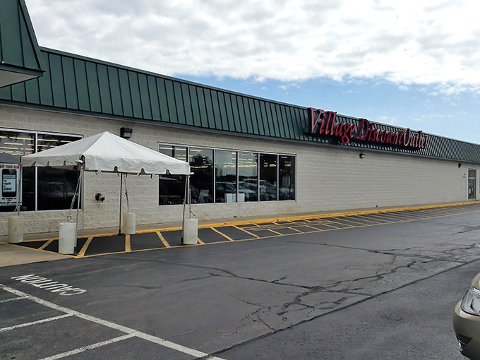 Under that iconic green roof and bold red signage lies a kingdom where fashion dreams come true for pennies on the dollar.