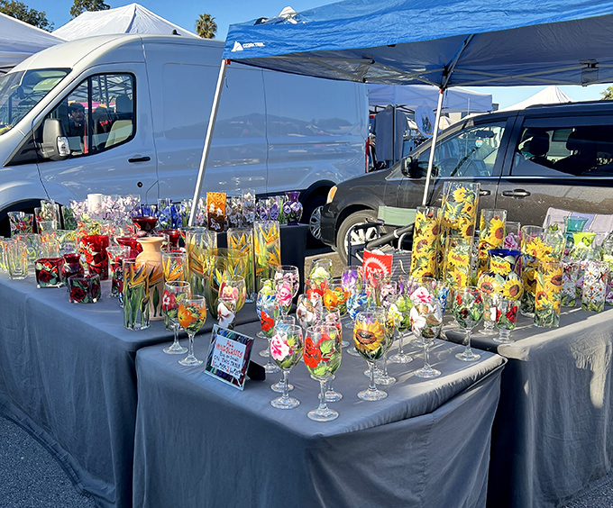 Handcrafted glassware catches the sunlight like liquid rainbows, each piece telling a different story waiting to brighten someone's home.