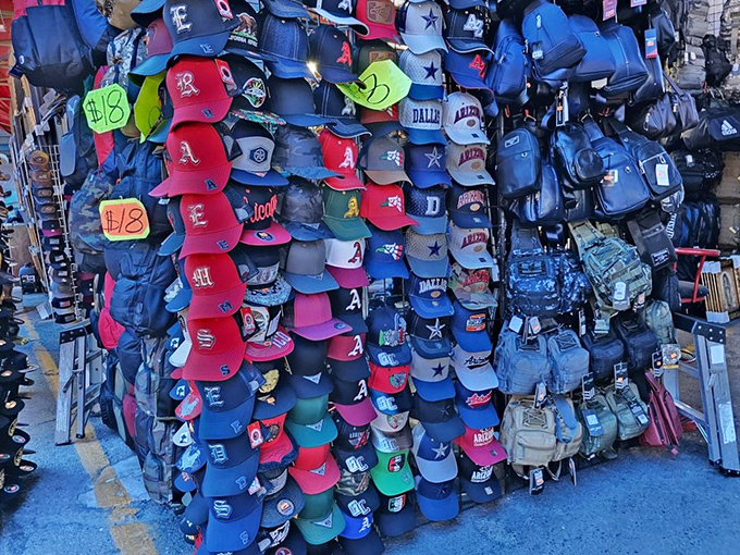 Baseball cap heaven where team loyalty meets budget-friendly prices. Those neon price tags are practically screaming "take me home to watch the game!"