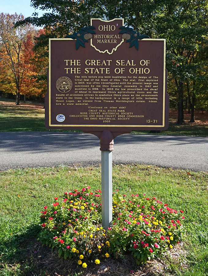 History stands tall amid autumn splendor. This marker tells the story behind Ohio's state seal&mdash;inspired by these very hills you can explore today.