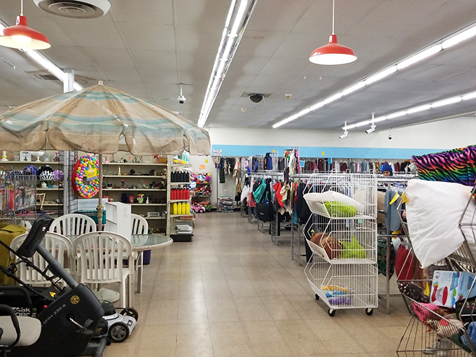 Beach umbrellas indoors? This colorful corner showcases summer gear alongside racks of potential wardrobe refreshers&mdash;thrift shopping at its most eclectic.