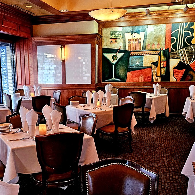 Classic steakhouse elegance meets artistic flair. The martini-themed artwork reminds you that some partnerships&mdash;like steak and cocktails&mdash;are simply meant to be.