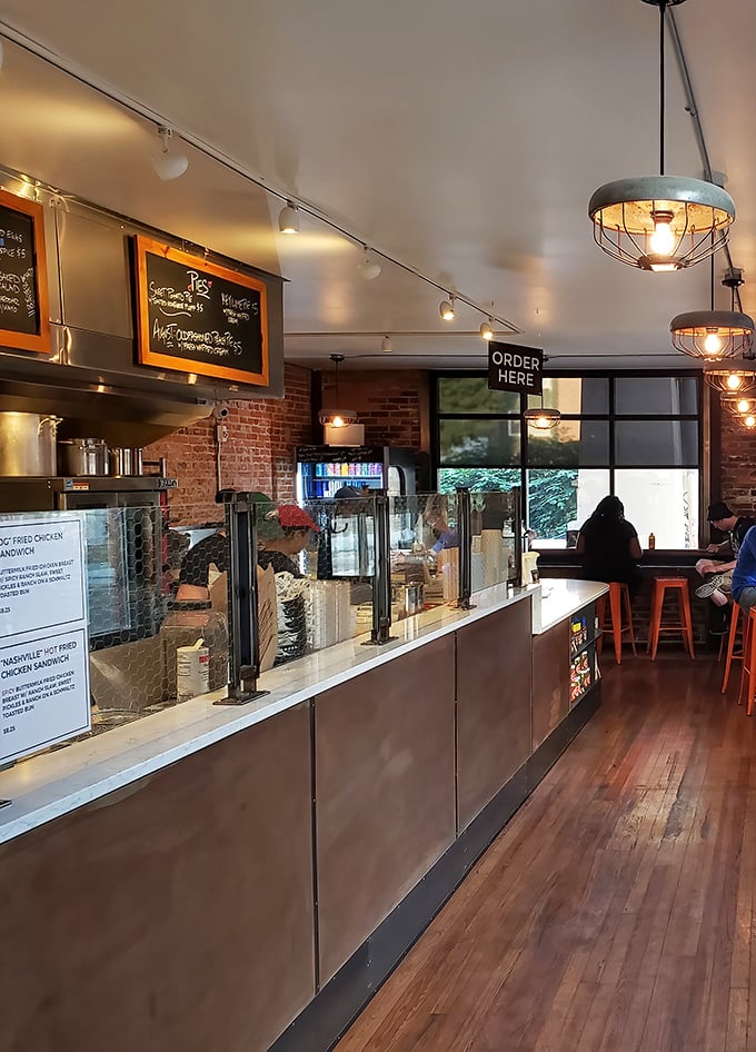 Industrial chic meets Southern comfort in this streamlined interior. The "Order Here" sign might as well say "Happiness Begins Here."