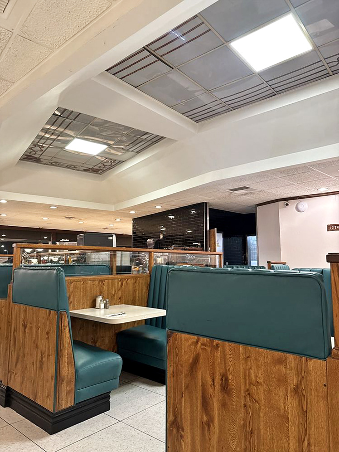 Classic diner booths in that perfect shade of turquoise, where conversations flow as freely as the coffee. Time stands deliciously still here.