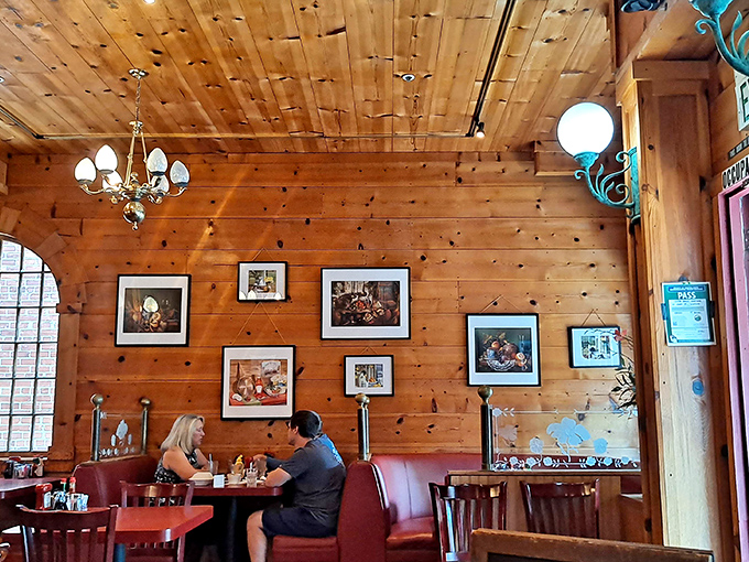 Knotty pine walls and vintage chandeliers create the perfect backdrop for breakfast conversations that flow as easily as the bottomless coffee.