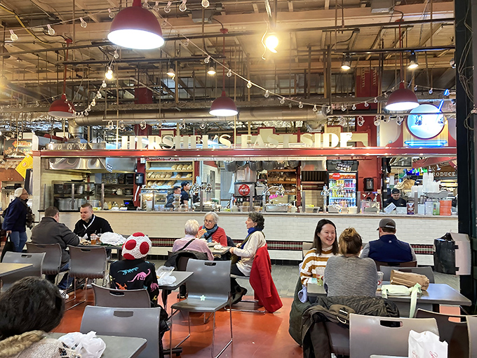 The simple seating arrangement speaks volumes: here, the food does all the talking while market-goers savor every bite.