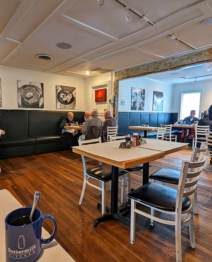 Inside Buttermilk Kitchen, warm wooden floors and simple white tables create the perfect canvas for the culinary masterpieces about to arrive at your table.