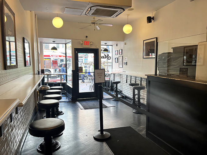 Simplicity reigns supreme inside &ndash; clean lines, white tiles, and counter seating where sandwich dreams materialize. No distractions from the main event.