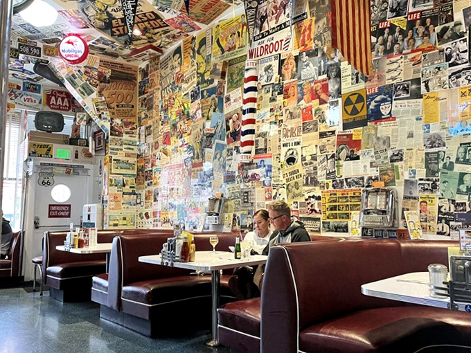 Every inch of wall space tells a story here. The vintage-plastered interior makes you wonder if the decorators ever met a 1950s advertisement they didn't like.