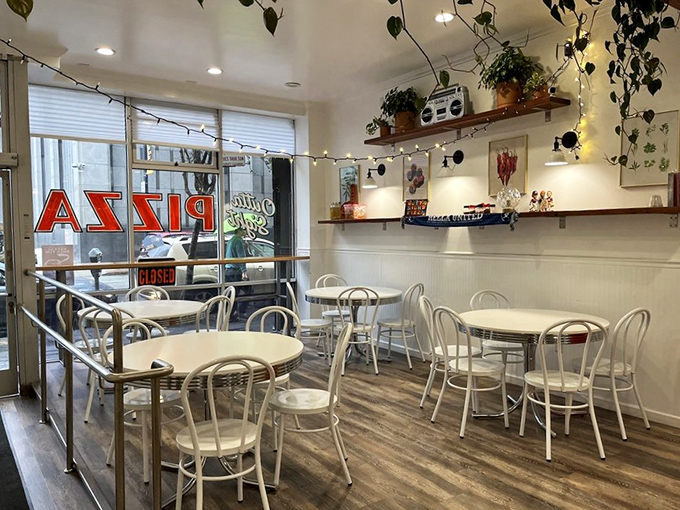 Simplicity reigns supreme inside with white tables, subway tiles, and hanging plants. The kind of place where the food, not the decor, does all the talking.