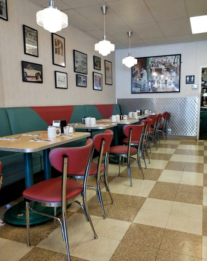 Classic diner aesthetics done right&mdash;checkerboard floors, vintage photos, and those red vinyl chairs that have cradled generations of happy eaters.