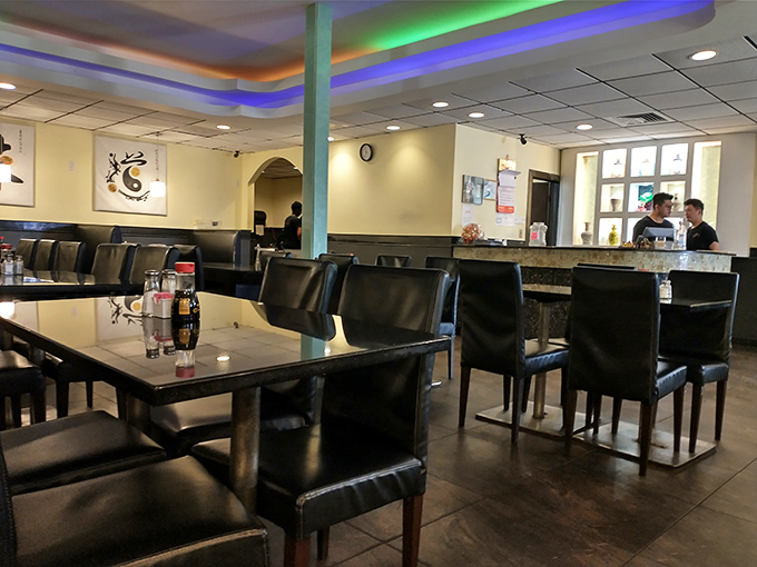 Black leather chairs and subtle blue lighting create an atmosphere that says, "Stay awhile, have seconds, maybe thirds." No judgment here, only satisfaction.