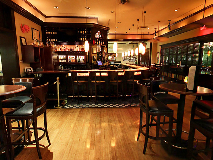 The bar at Truluck's isn't just a waiting area—it's a destination unto itself, with that classic checkerboard floor saying "sophisticated fun ahead."